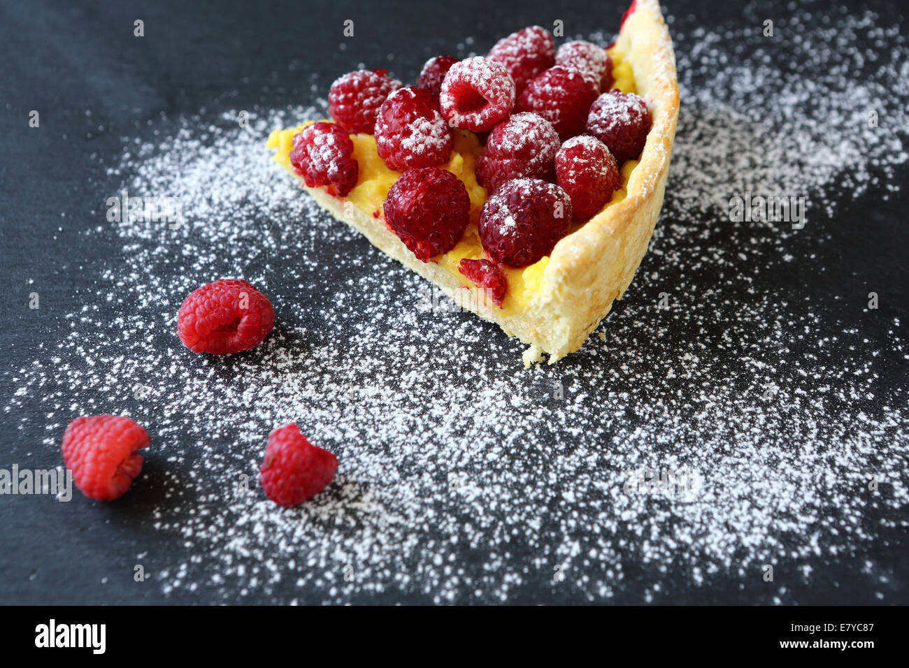 Slice crispy tart with raspberries, close-up Stock Photo - Alamy