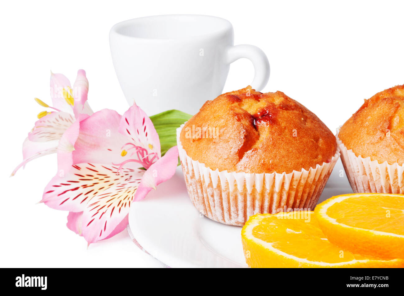 Two muffins, orange and flowers on a white background Stock Photo - Alamy