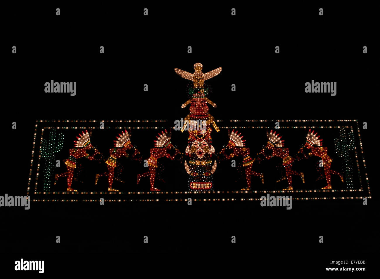 Night view 6 North American Indians, one leg raised, dancing around ...