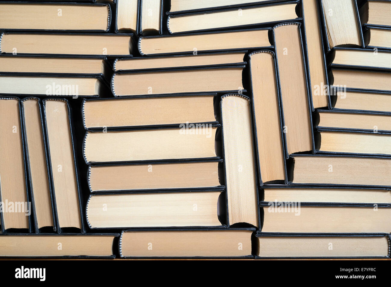 A wall of books stacked Stock Photo - Alamy