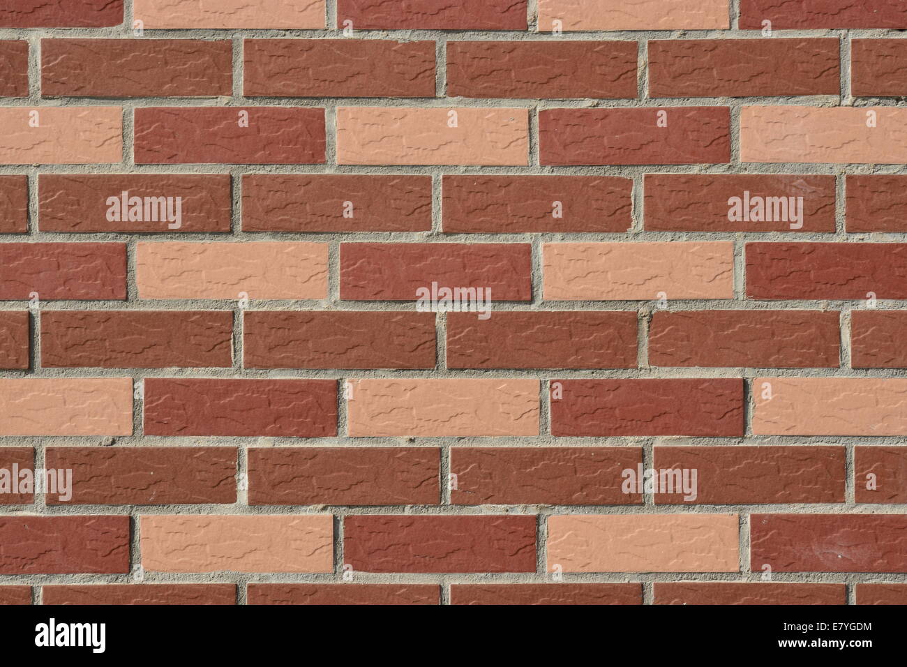 Brick wall with red and pink bricks Stock Photo - Alamy