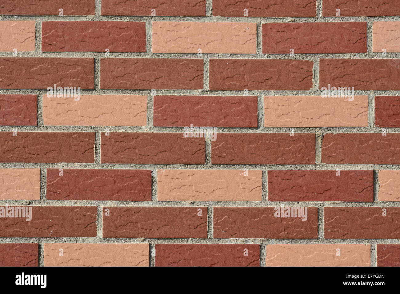 Brick wall with red and pink bricks Stock Photo - Alamy