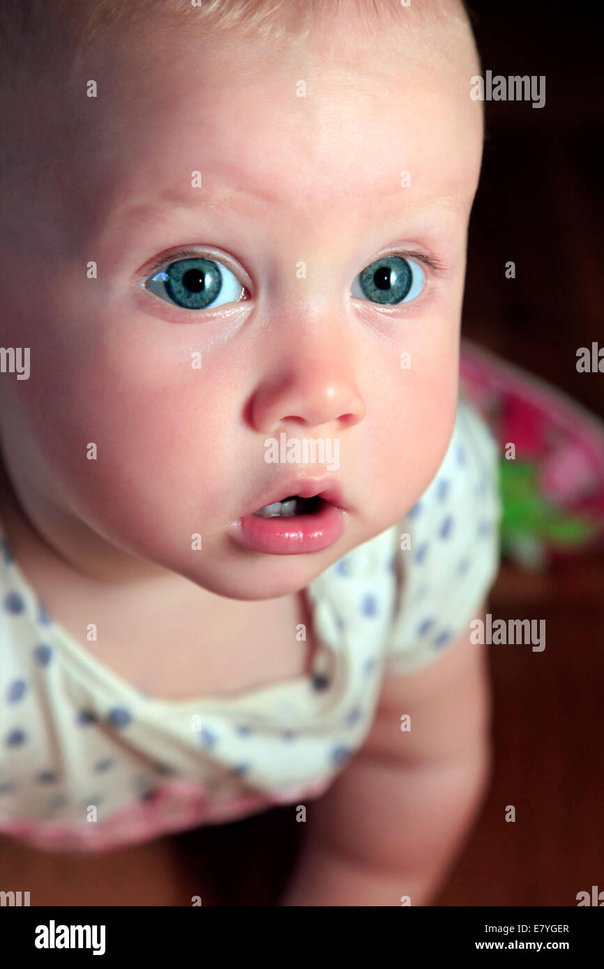 Portrait of a beautiful little girl with a surprised face Stock Photo ...