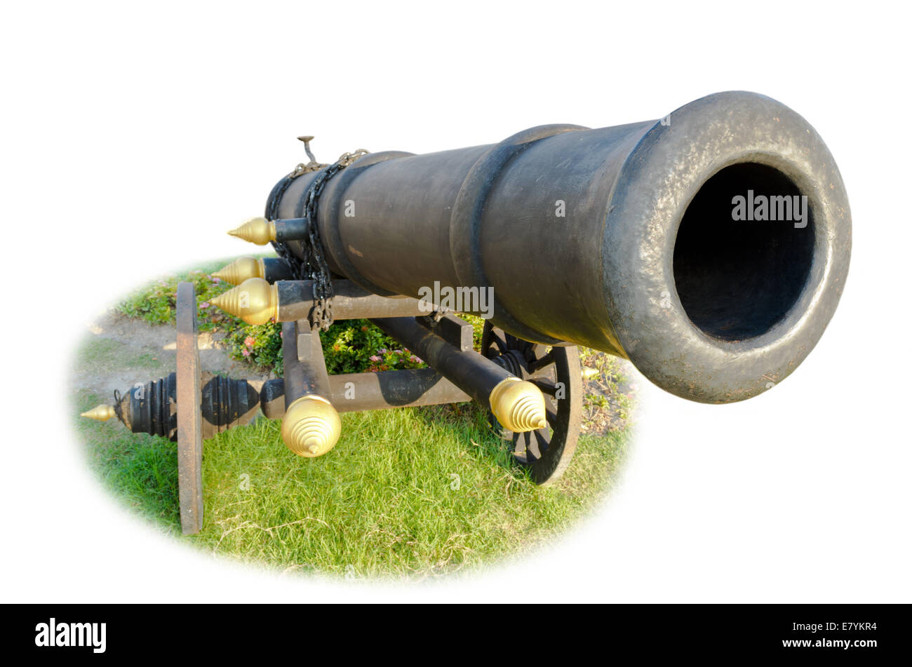 Cannon on wheels moving in grass. Thailand's ancient weapons on white ...