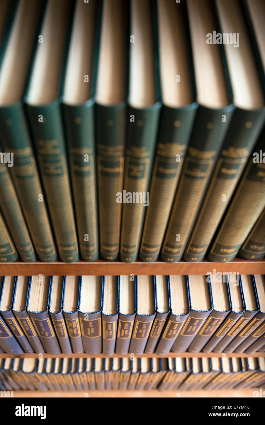 Bookshelf in library with many books. Shallow dof Stock Photo - Alamy