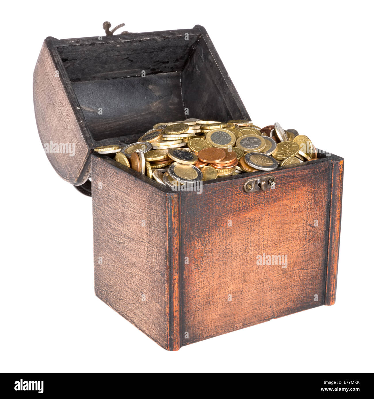 Wooden money chest filled with coins isolated at a white background ...