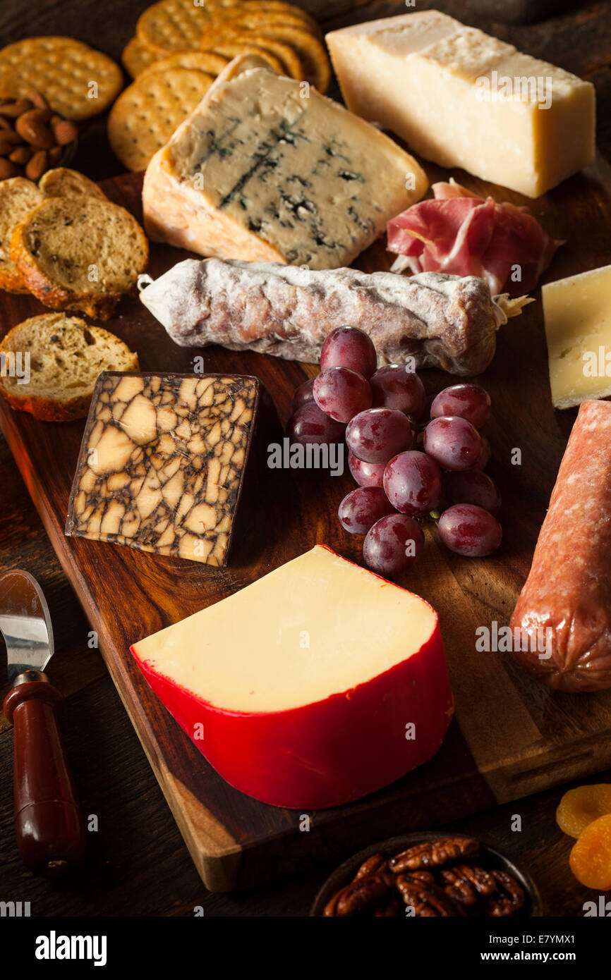 Fancy Meat and Cheeseboard with Fruit as an Appetizer Stock Photo - Alamy