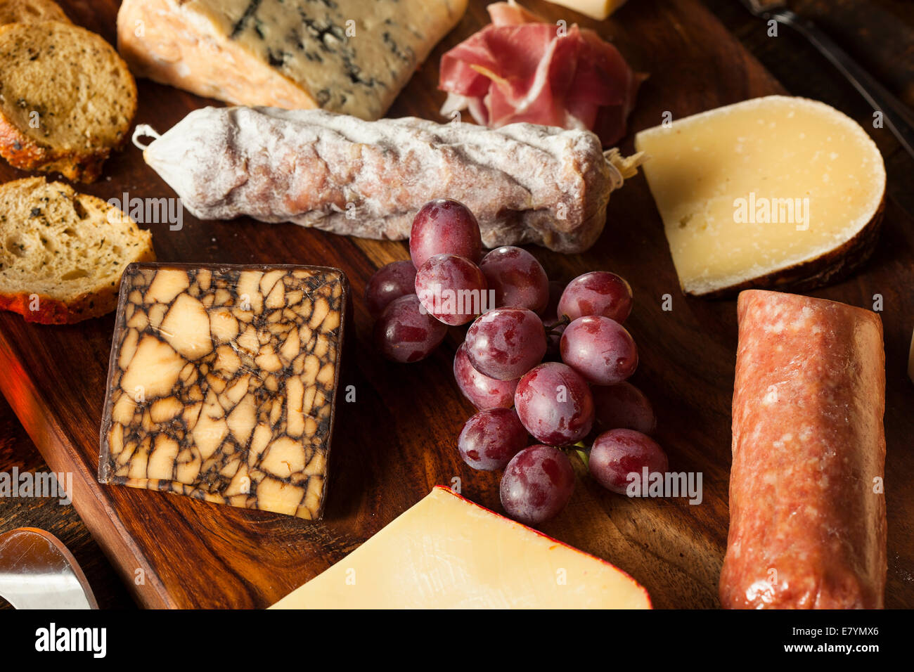 Fancy Meat and Cheeseboard with Fruit as an Appetizer Stock Photo - Alamy
