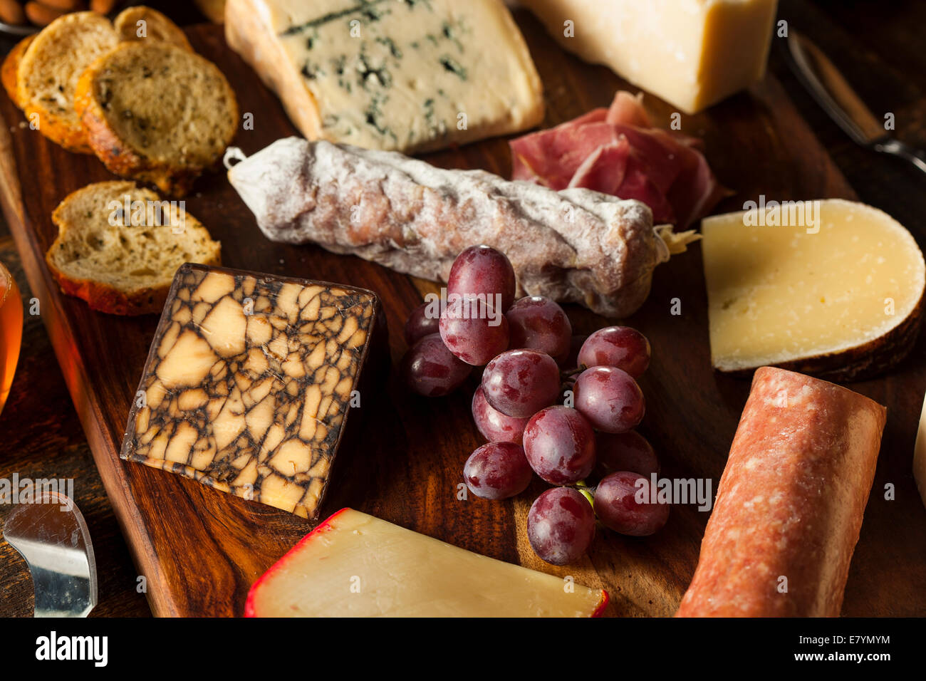 Fancy Meat and Cheeseboard with Fruit as an Appetizer Stock Photo - Alamy