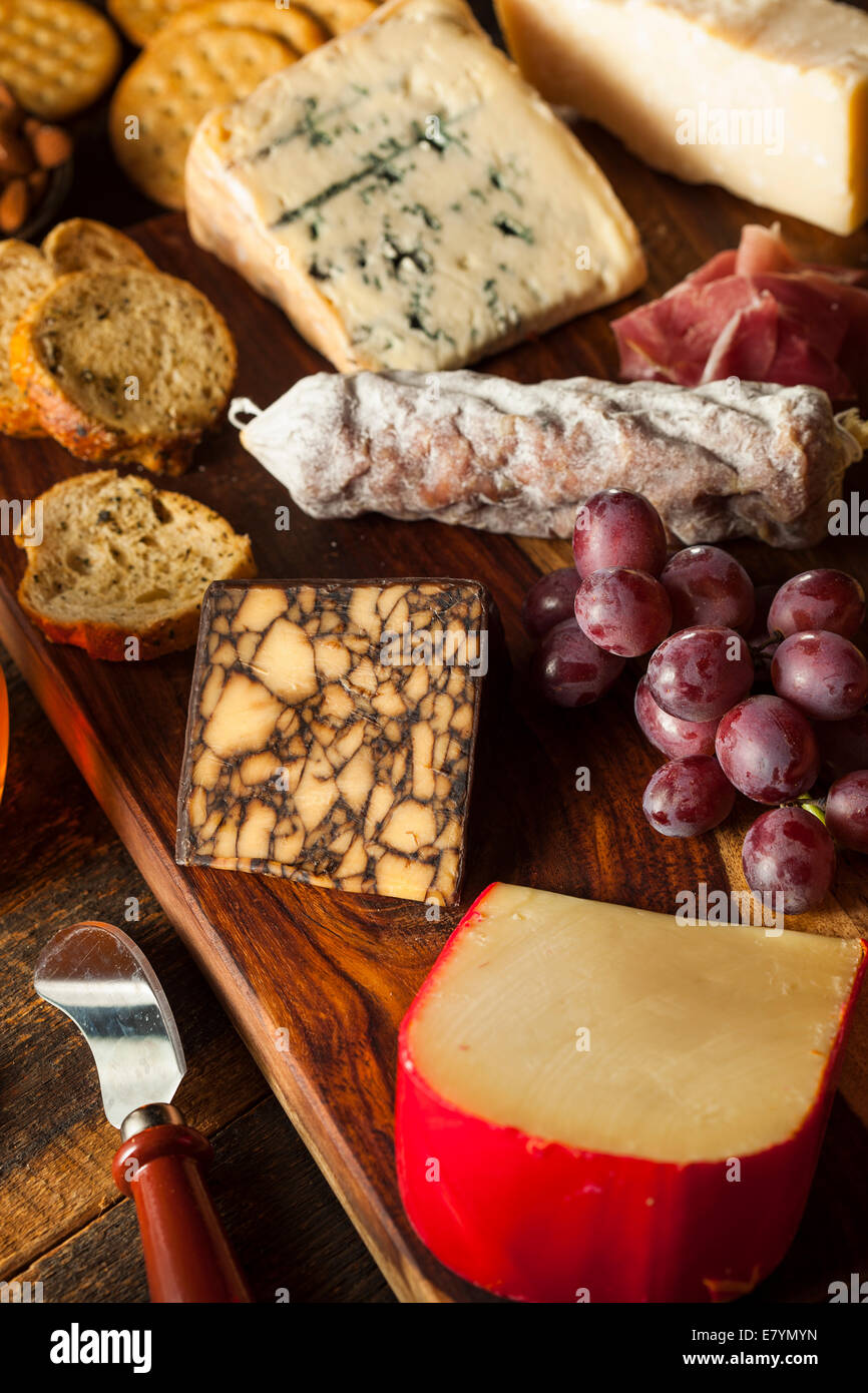 Fancy Meat and Cheeseboard with Fruit as an Appetizer Stock Photo - Alamy