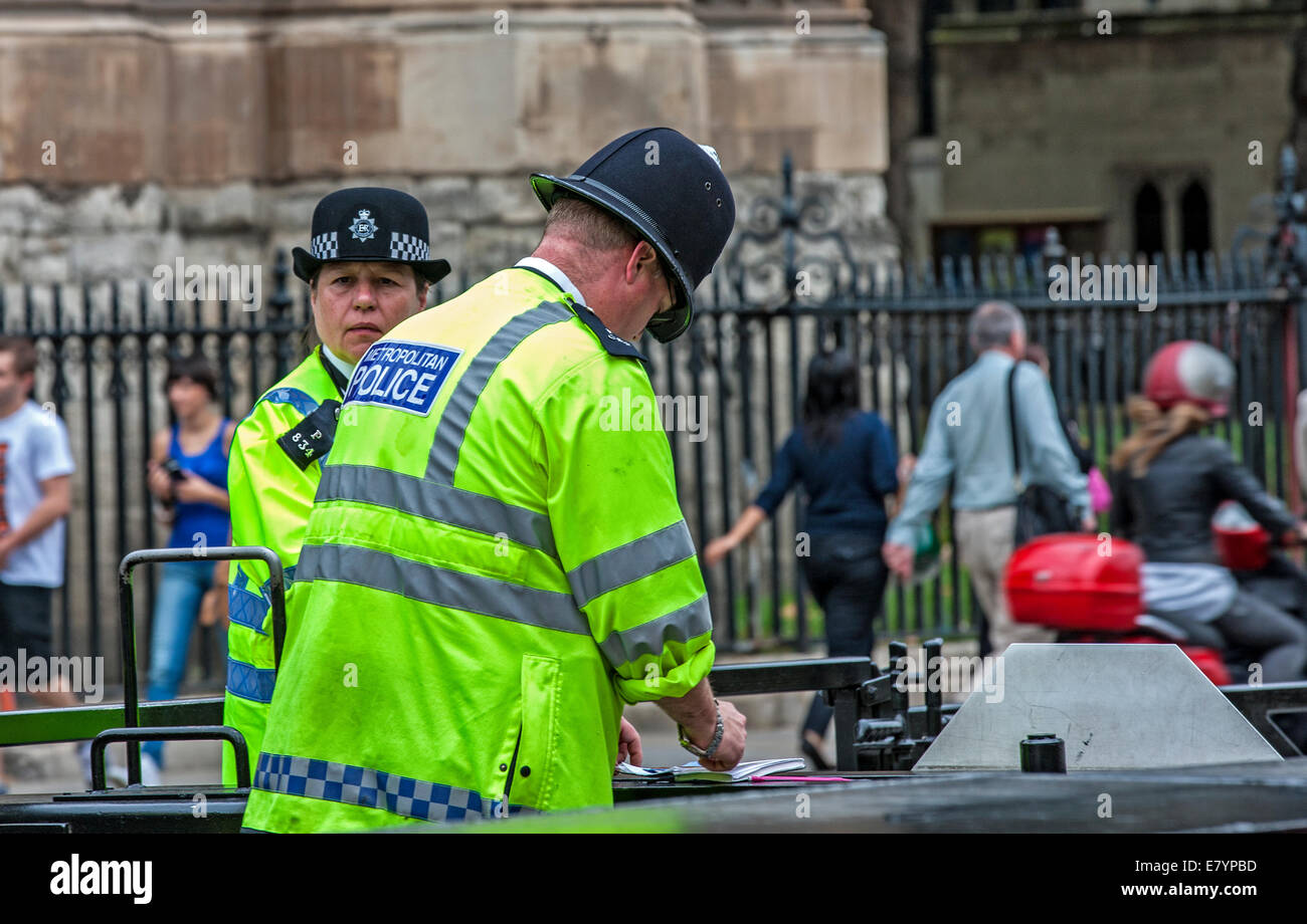 Two policemen London photographed in front of the Palace of Westminster ...