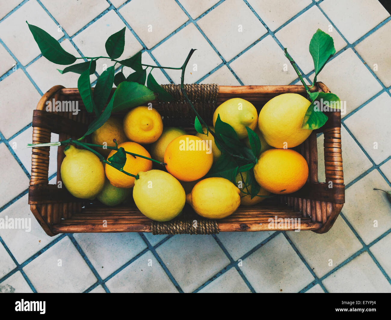 Lemons in basket Stock Photo - Alamy