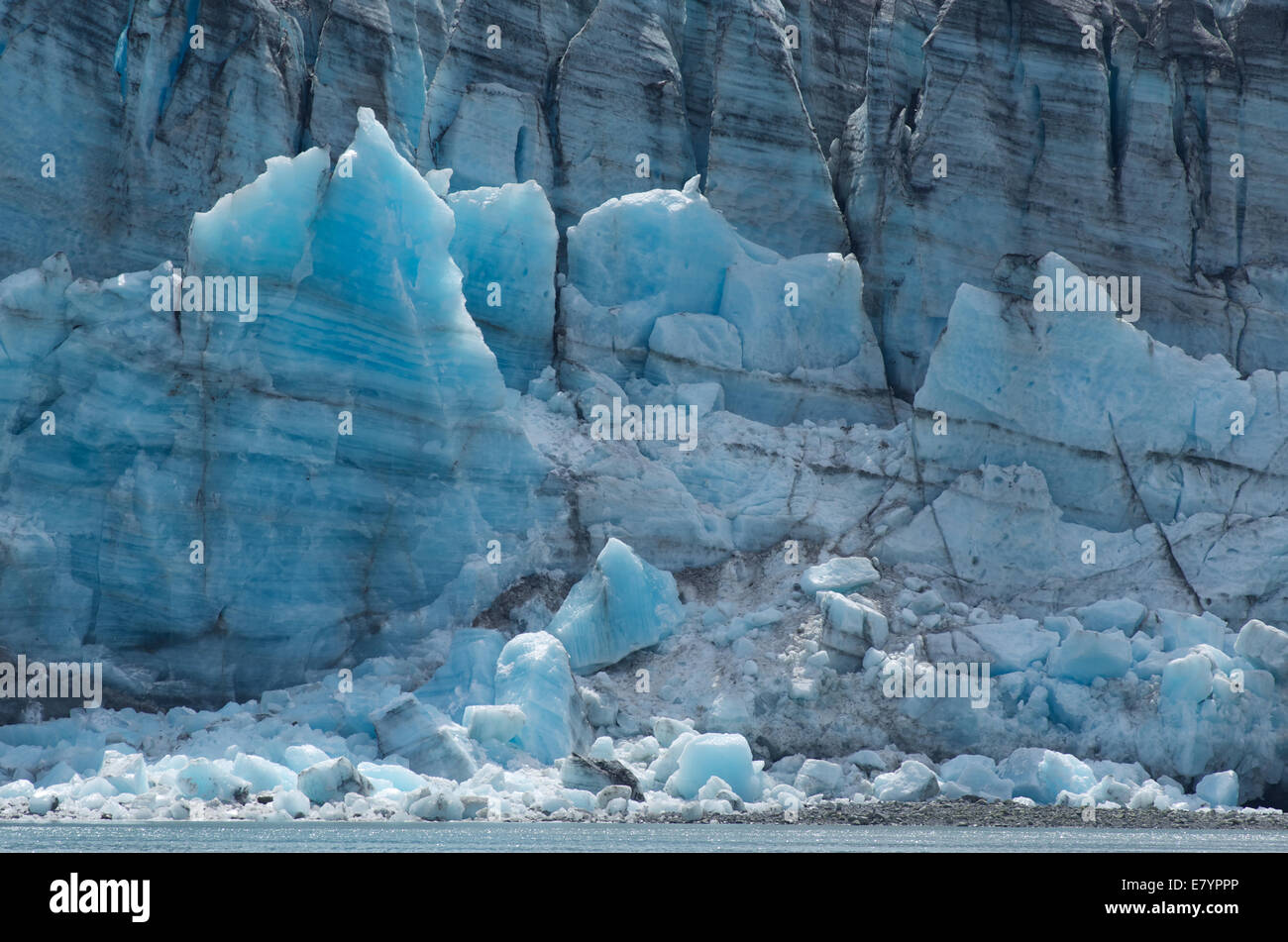 A horizontal slice of the deep blue Johns Hopkins Glacier in Glacier ...