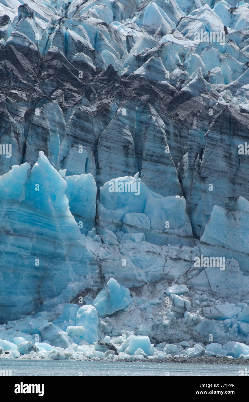 A vertical slice of the deep blue Johns Hopkins Glacier in Glacier Bay ...