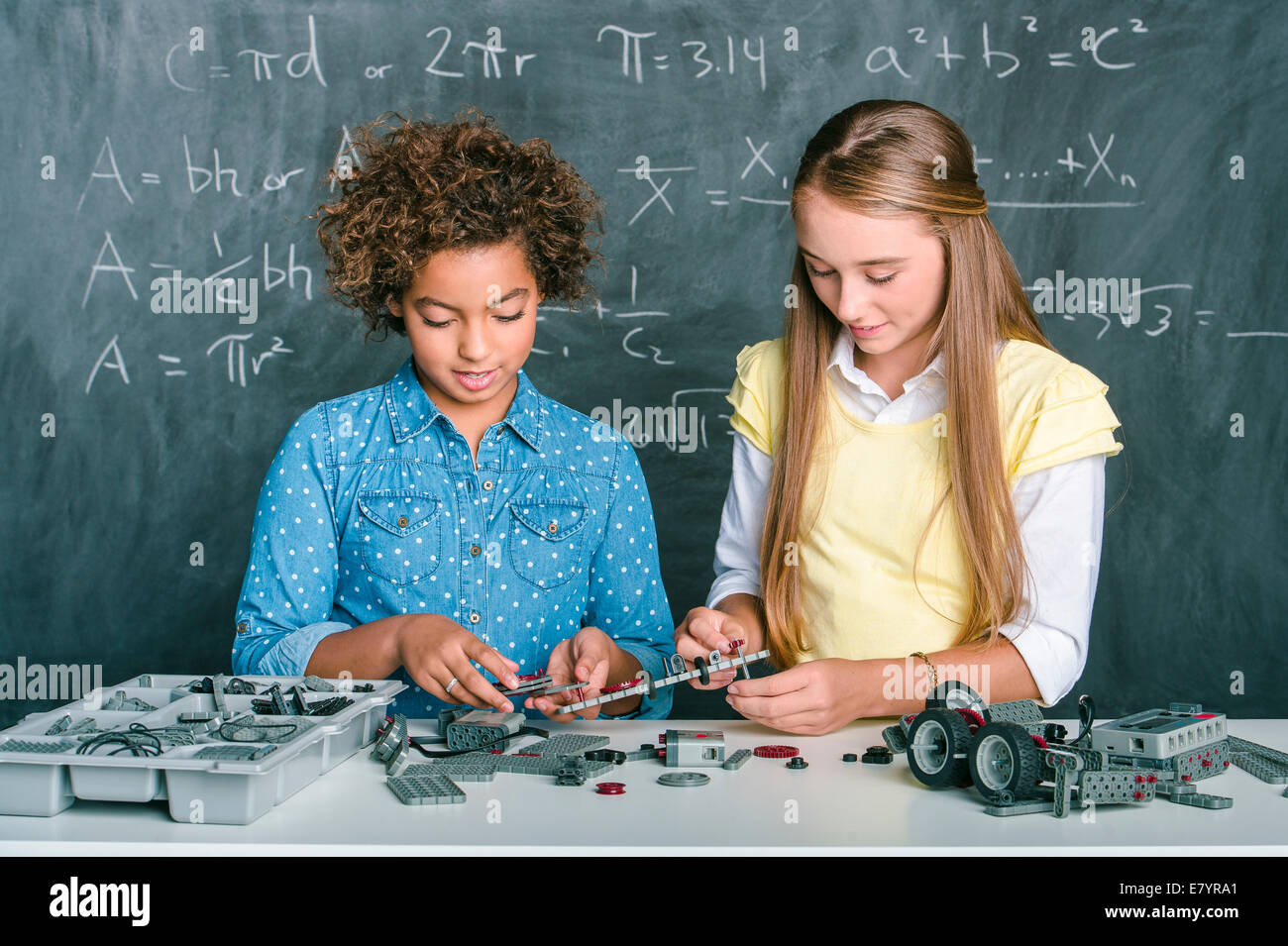 Two girls in classroom Stock Photo - Alamy