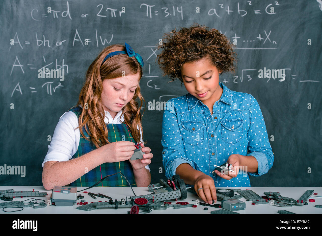 Two girls in classroom Stock Photo - Alamy