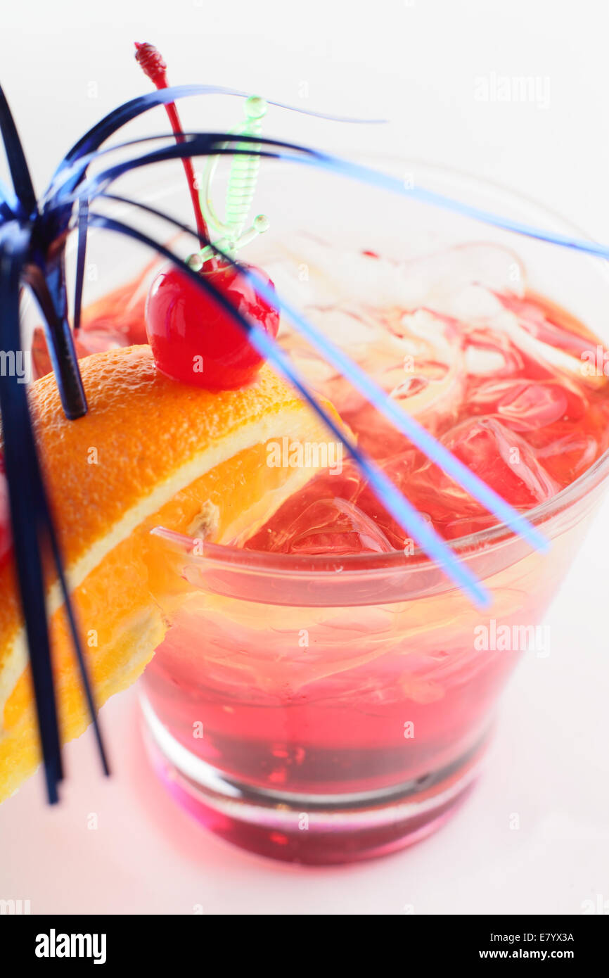 sunset color cocktail with ice and fruits Stock Photo - Alamy