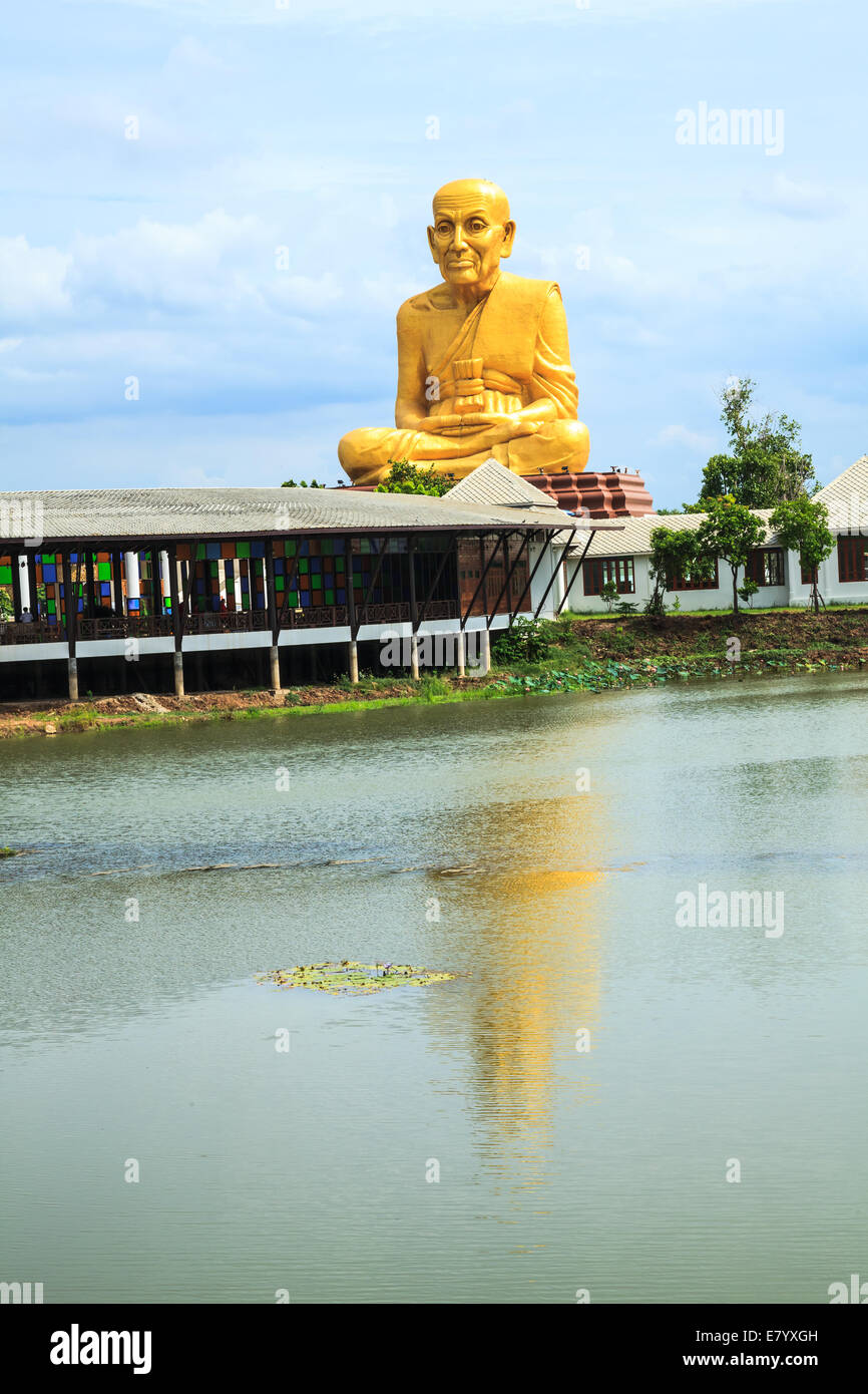 Giant statue of famous thai monk and the reflection, the statue is ...