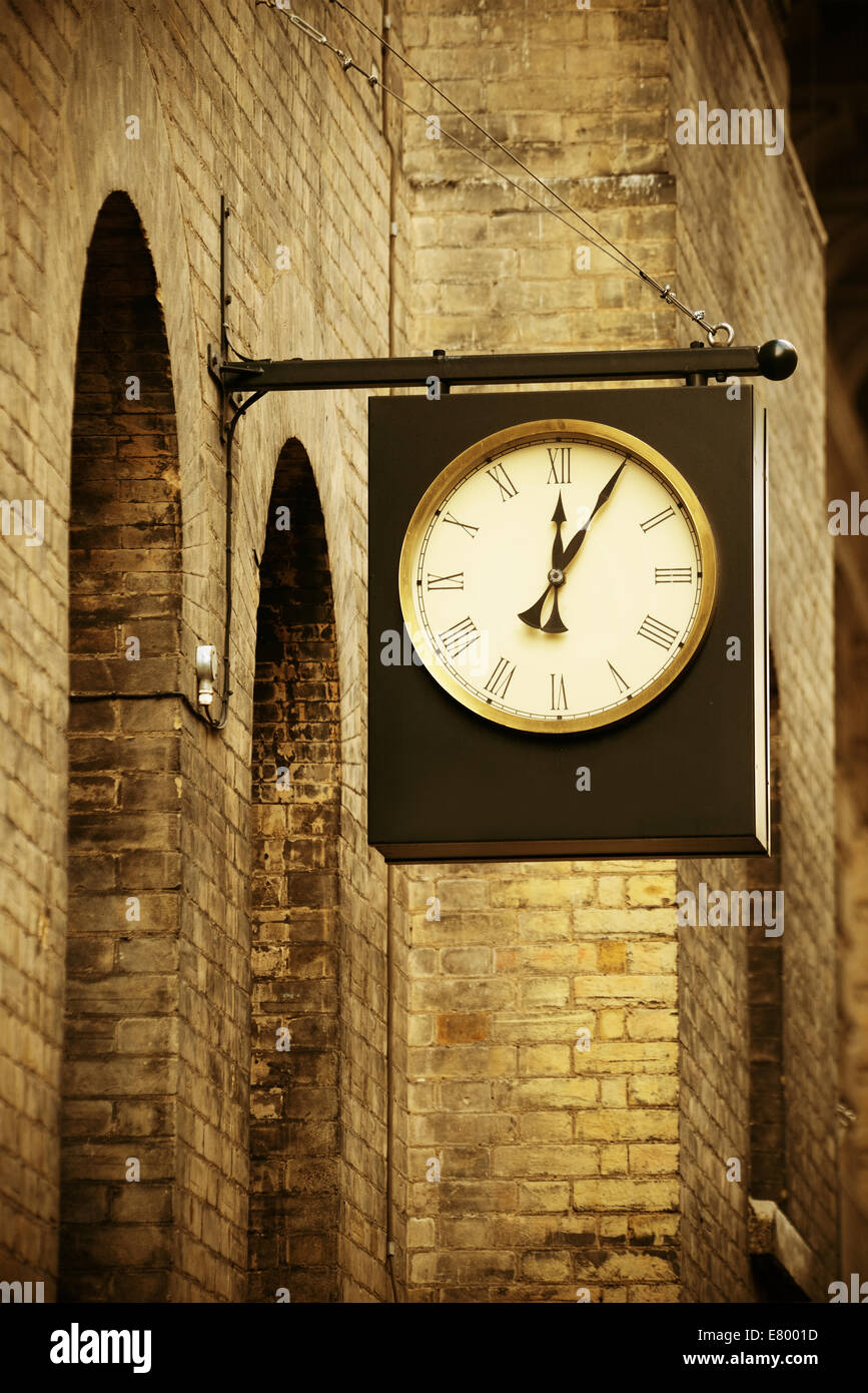 Urban historical architecture with vintage clock in street in London ...
