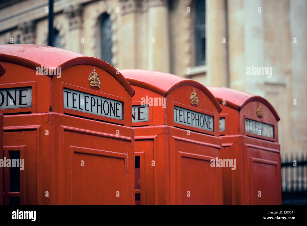 Red telephone box in street with historical architecture in London ...