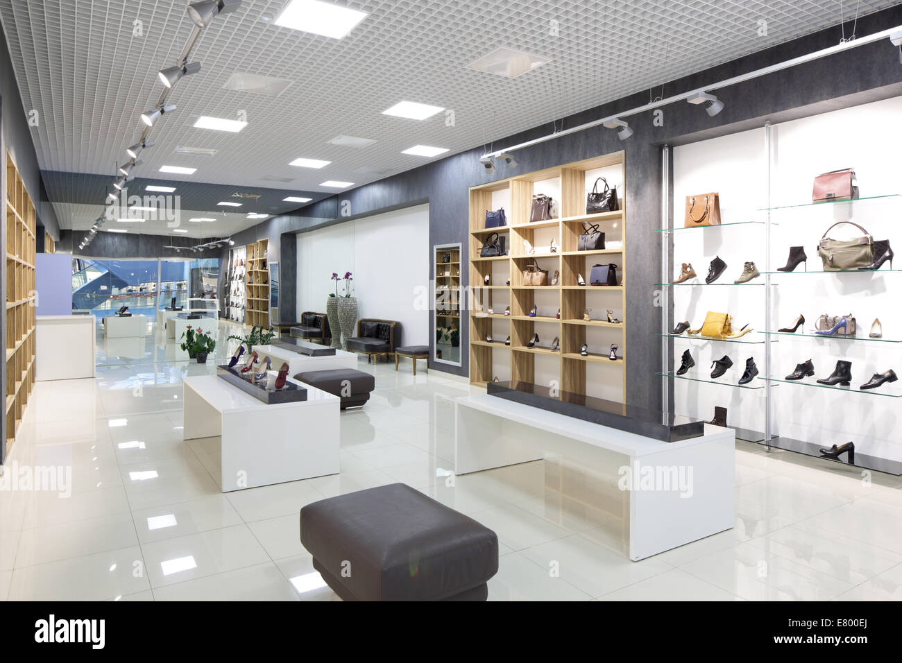bright and fashionable interior of shoe store in modern mall Stock ...
