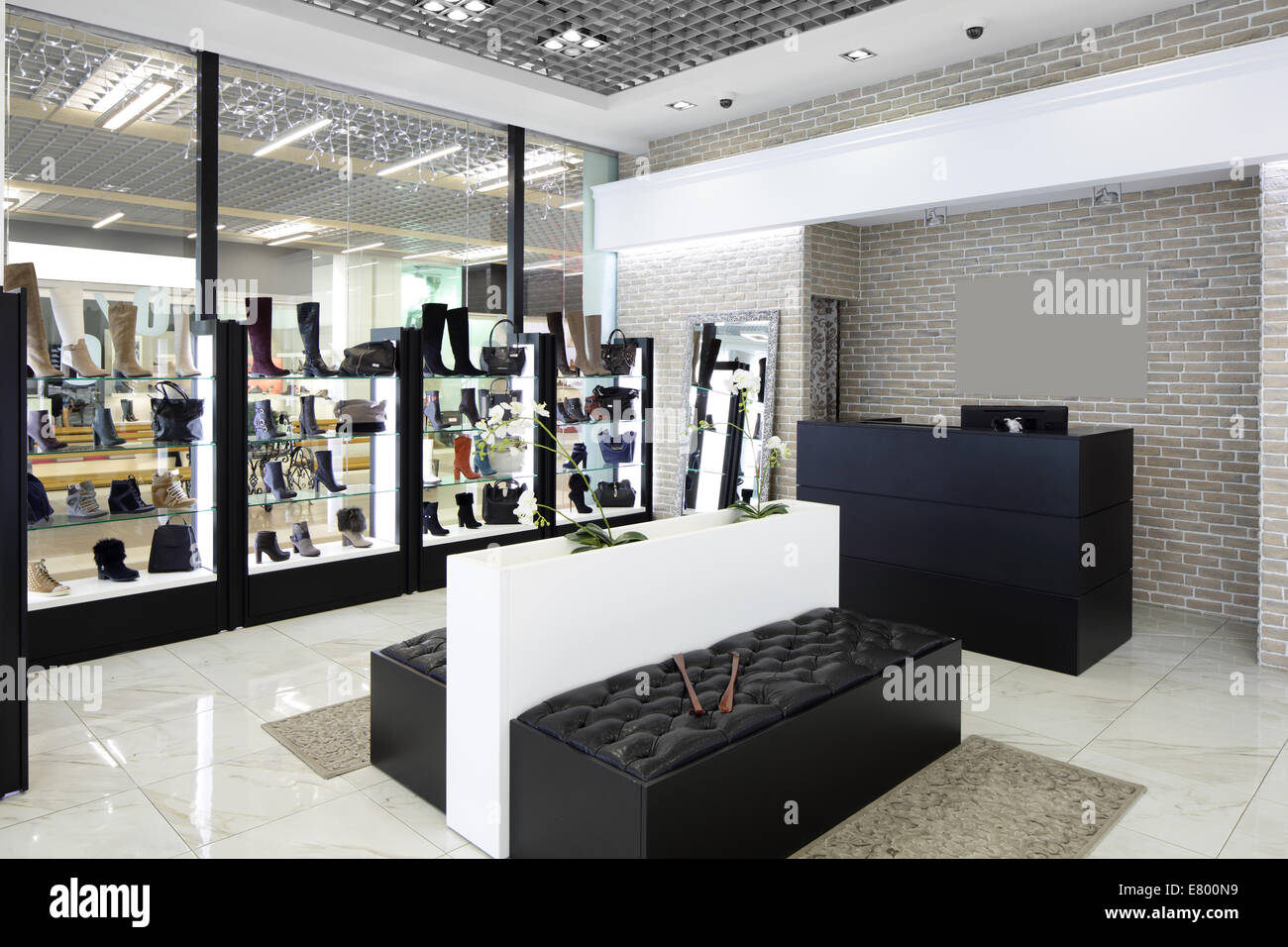 bright and fashionable interior of shoe store in modern mall Stock ...