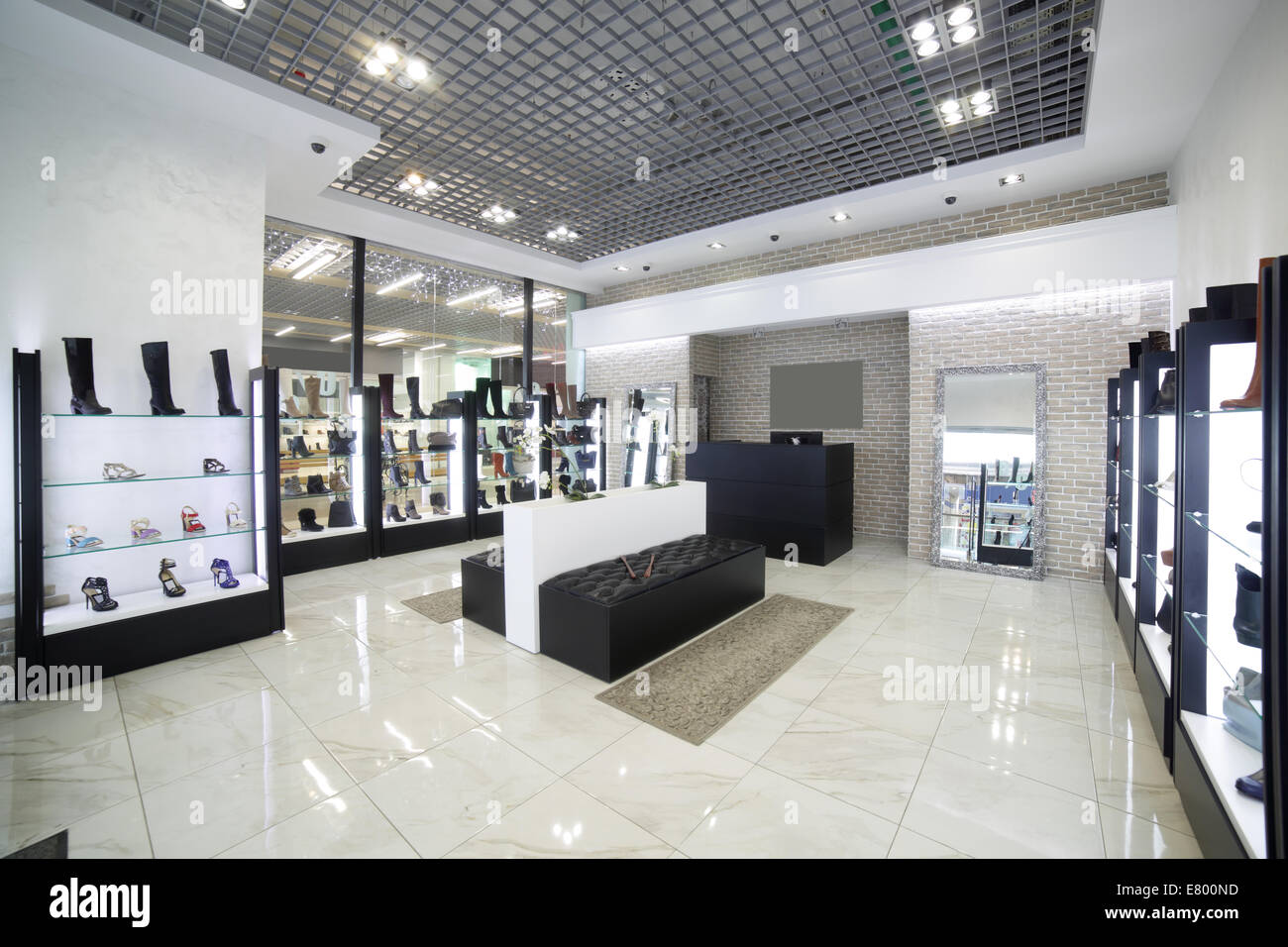 bright and fashionable interior of shoe store in modern mall Stock ...