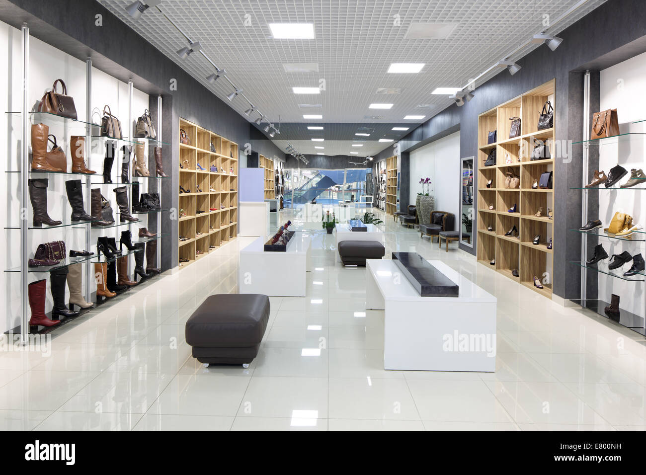 bright and fashionable interior of shoe store in modern mall Stock ...