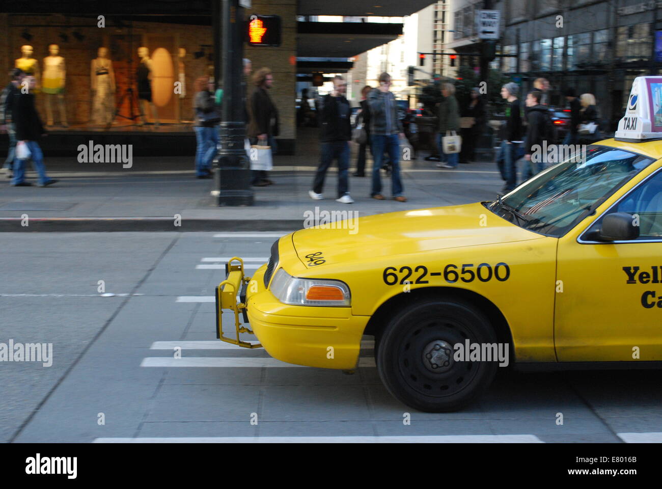 A yellow taxi speeds through the streets of Seattle Stock Photo - Alamy