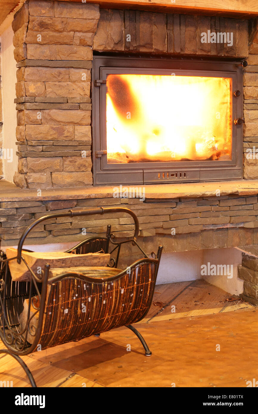 modern burning fire place in cozy house Stock Photo - Alamy