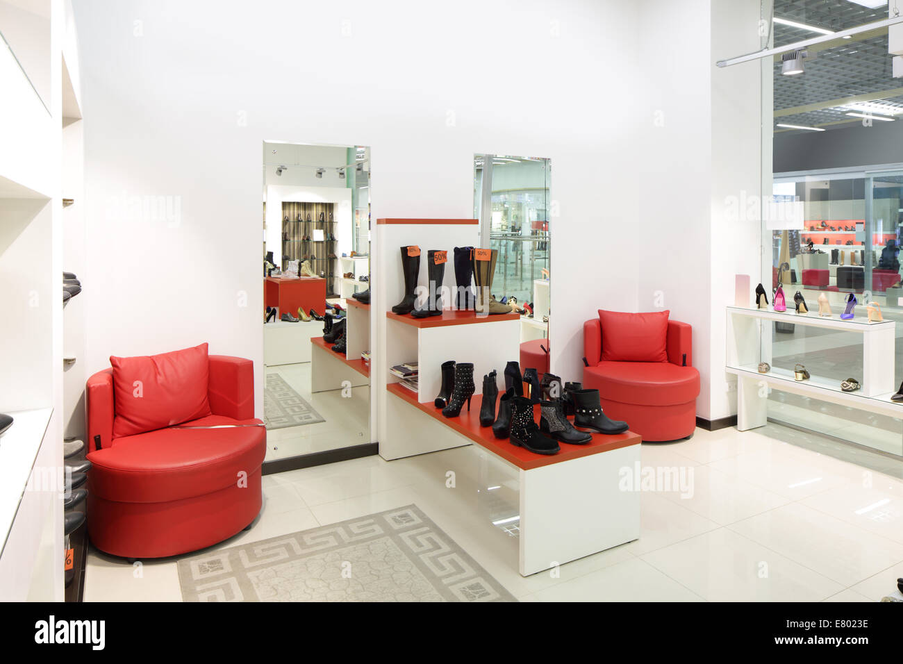 bright and fashionable interior of shoe store in modern mall Stock ...