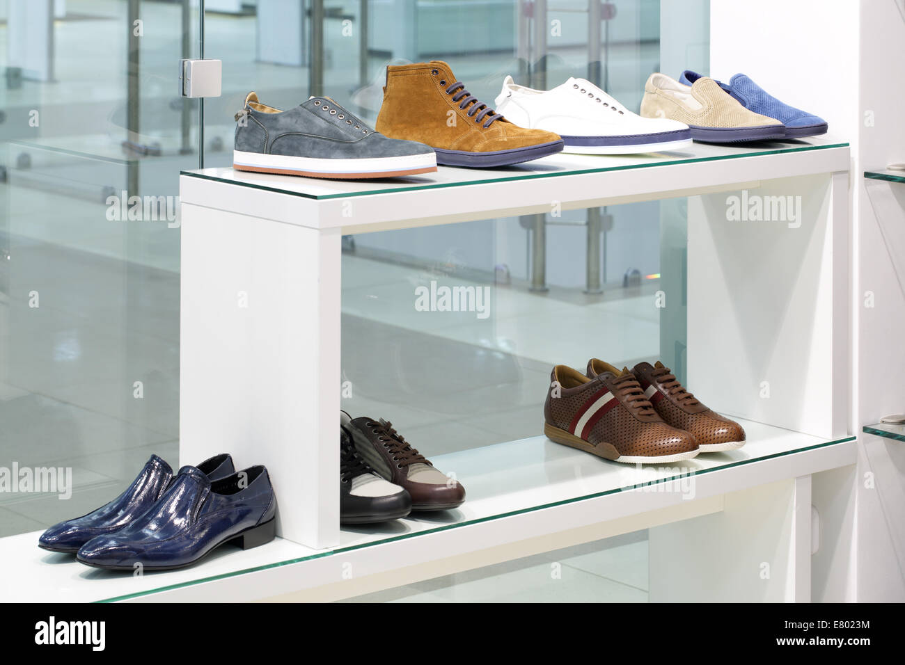 bright and fashionable interior of shoe store in modern mall Stock ...