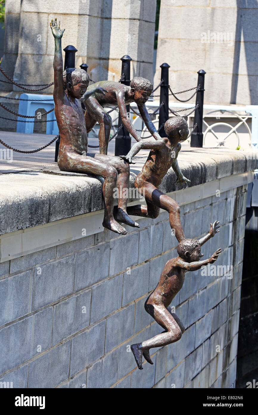 People of the River statue by Chong Fah Cheong of children jumping into ...