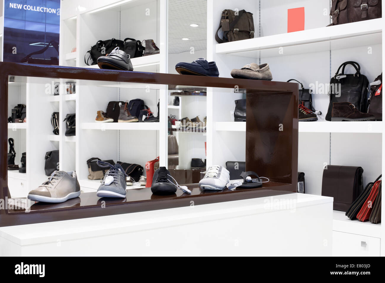 bright and fashionable interior of shoe store in modern mall Stock ...