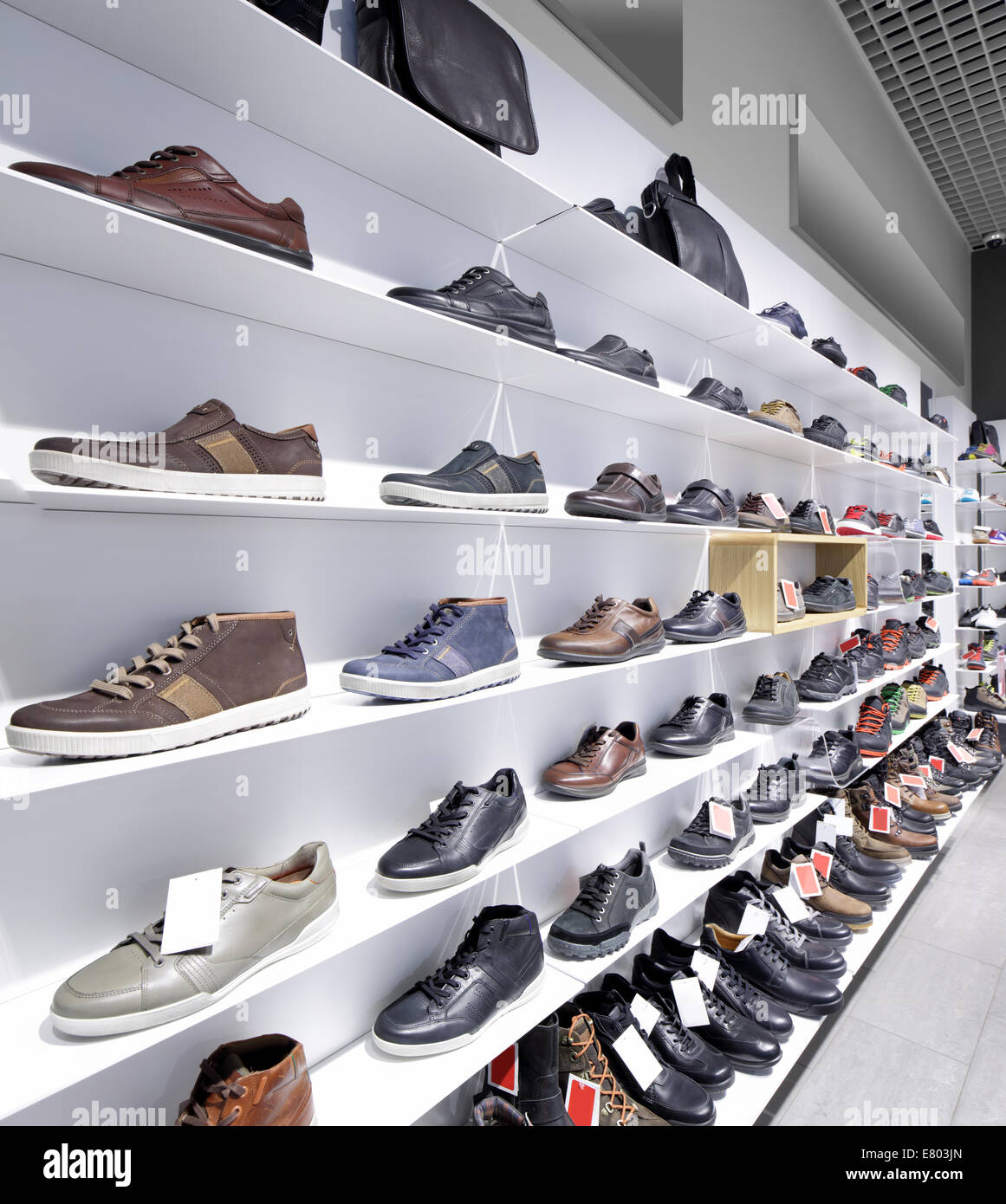 bright and fashionable interior of shoe store in modern mall Stock ...