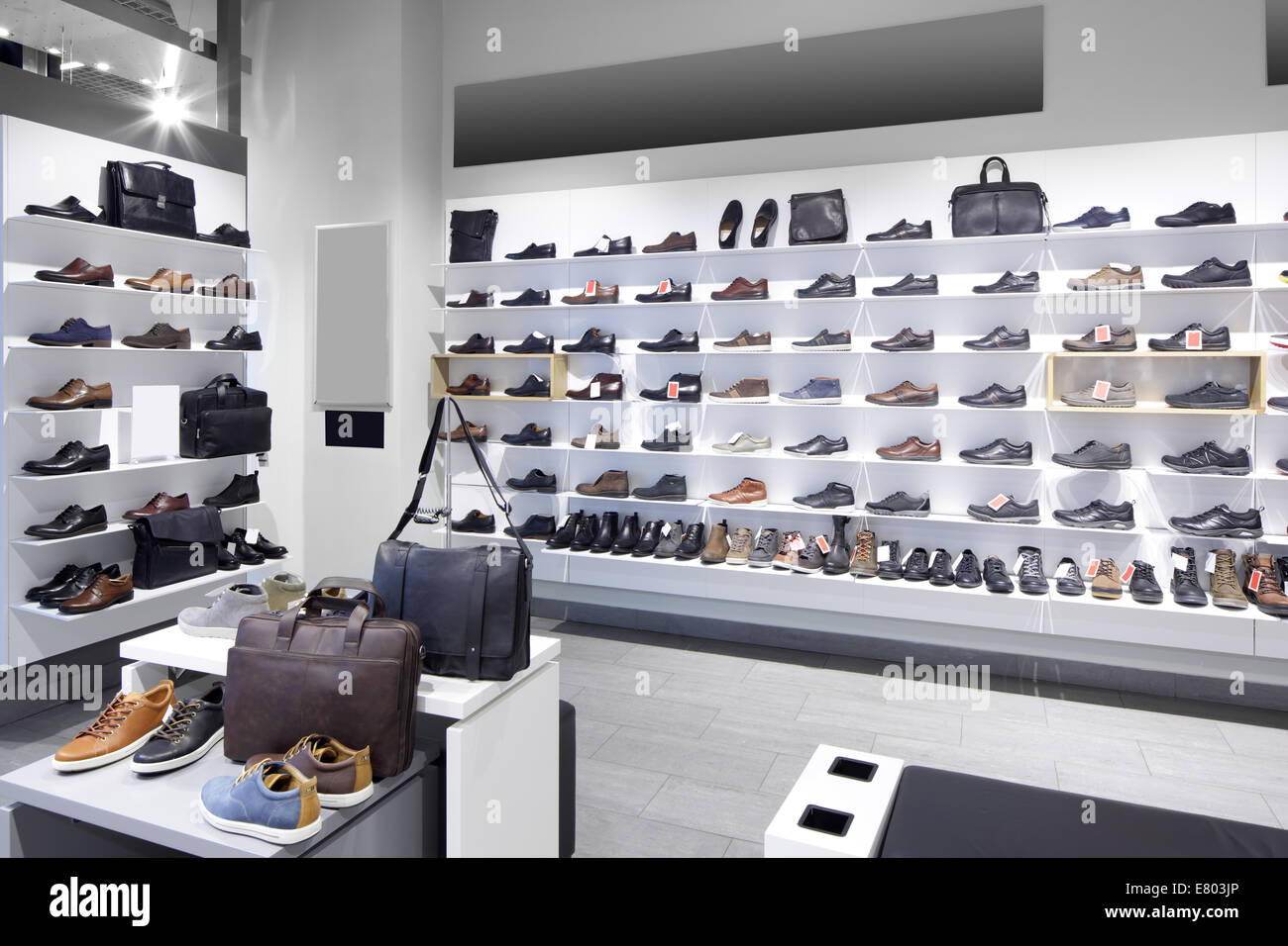 bright and fashionable interior of shoe store in modern mall Stock ...