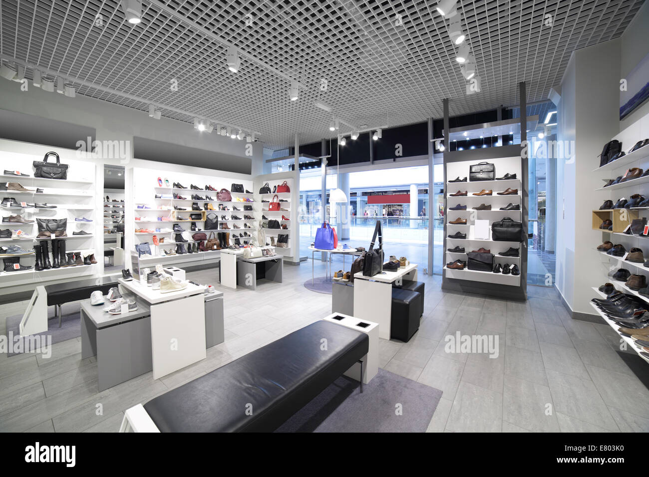 bright and fashionable interior of shoe store in modern mall Stock ...