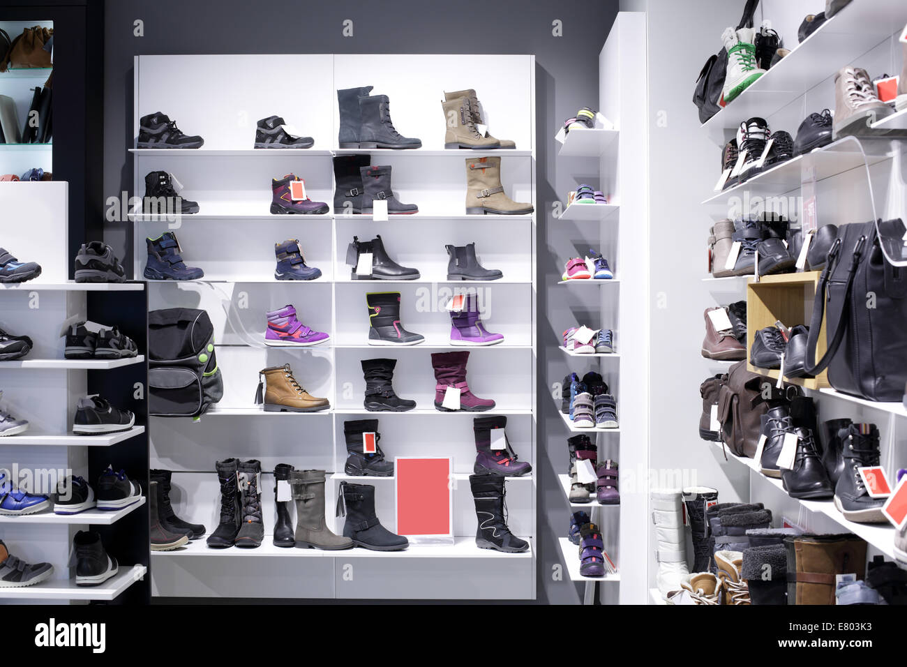 bright and fashionable interior of shoe store in modern mall Stock ...