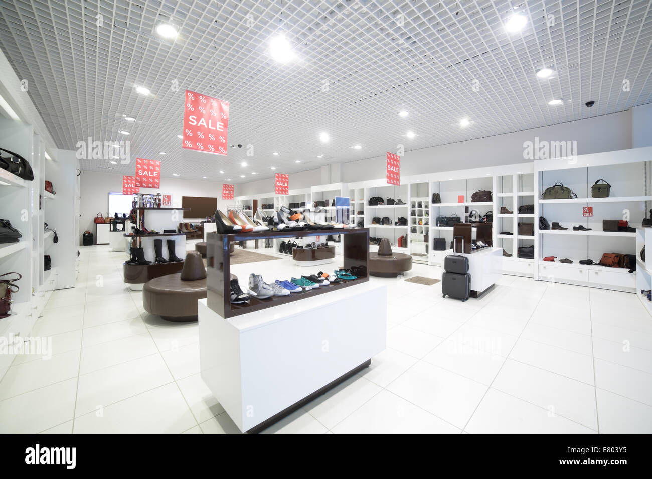 bright and fashionable interior of shoe store in modern mall Stock ...