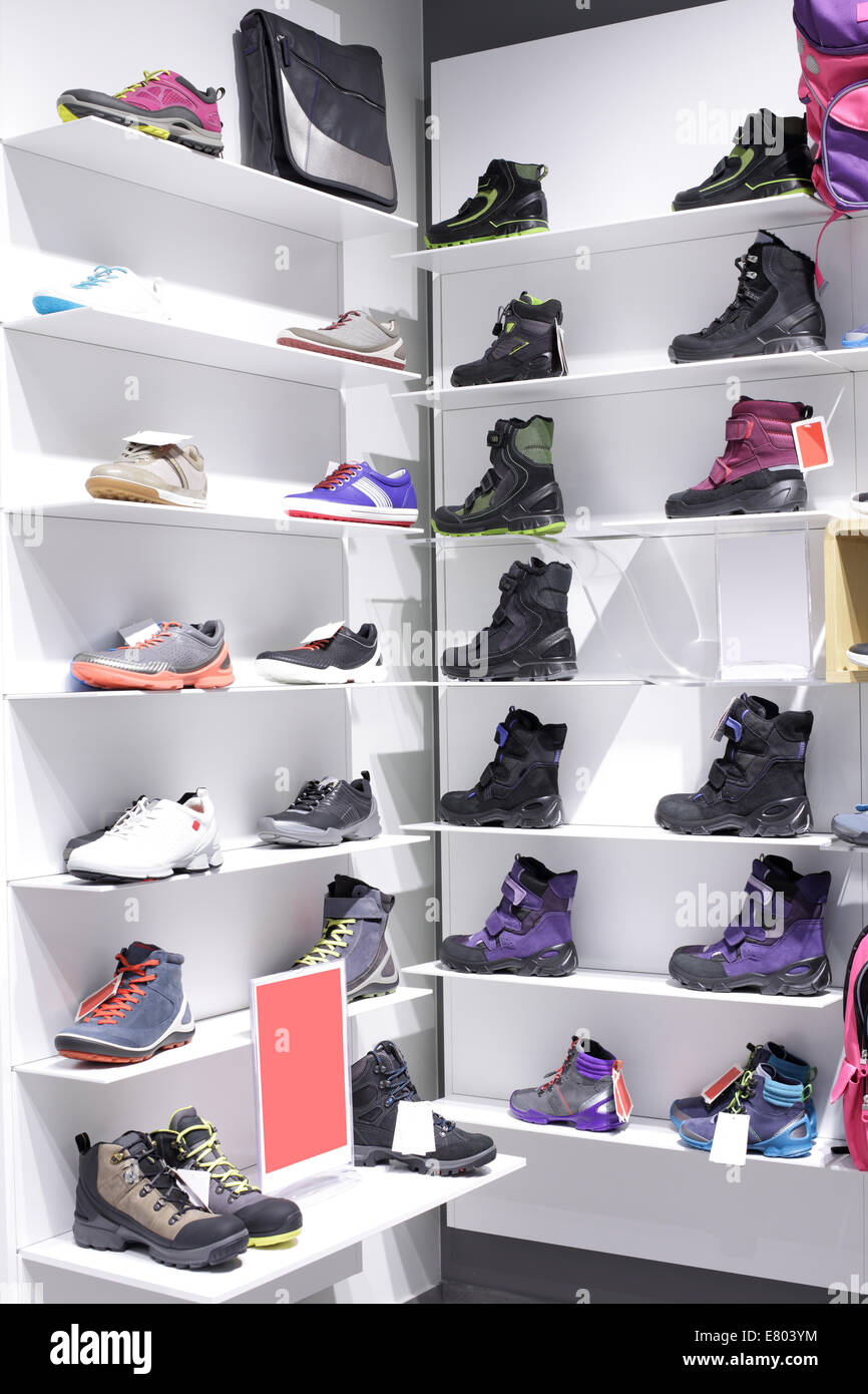 bright and fashionable interior of shoe store in modern mall Stock ...