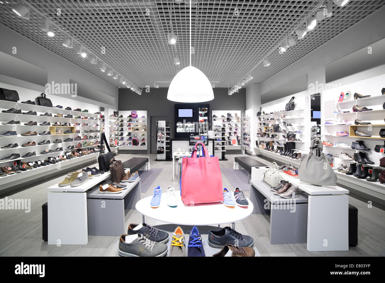 bright and fashionable interior of shoe store in modern mall Stock ...