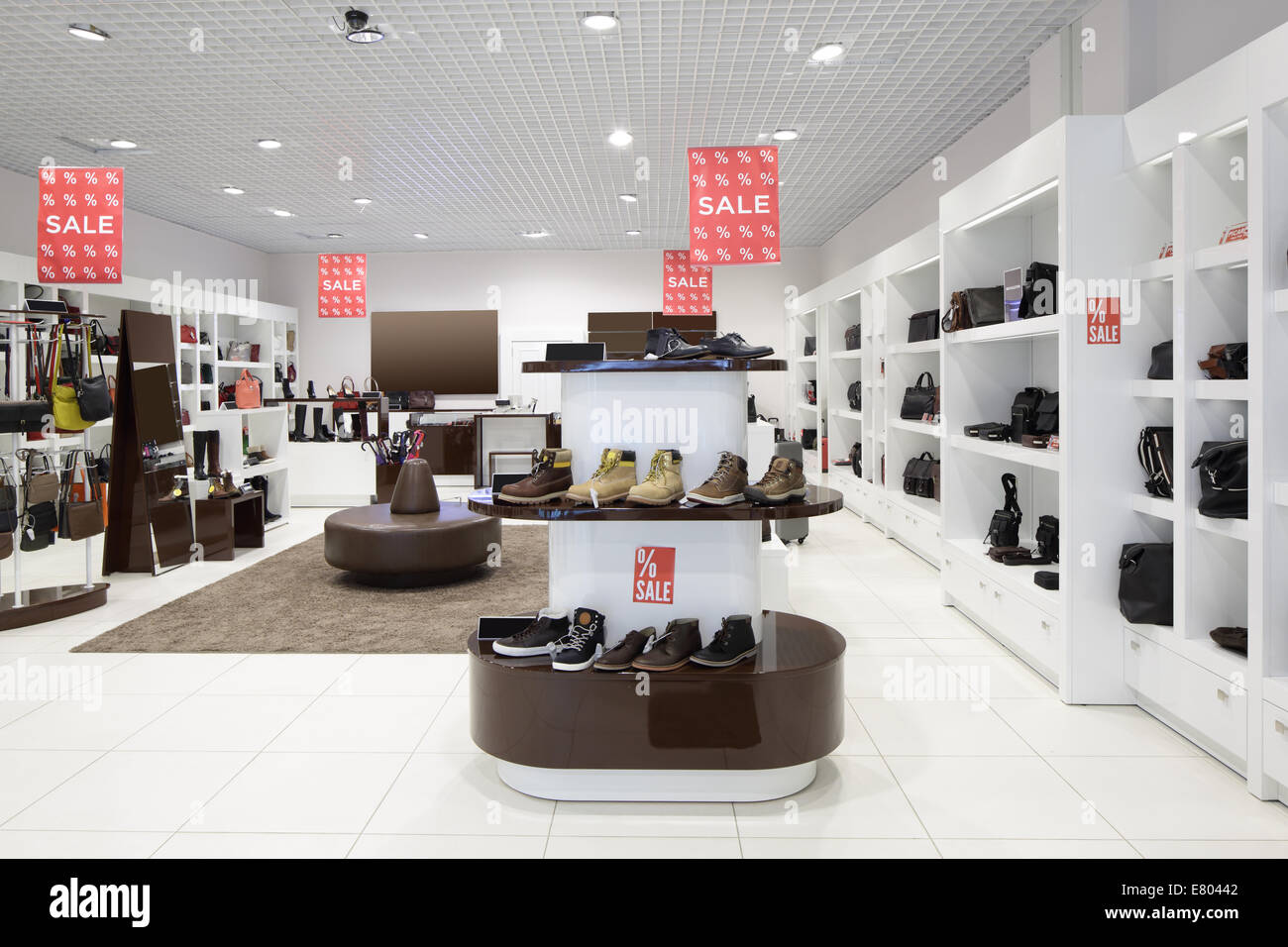 bright and fashionable interior of shoe store in modern mall Stock ...