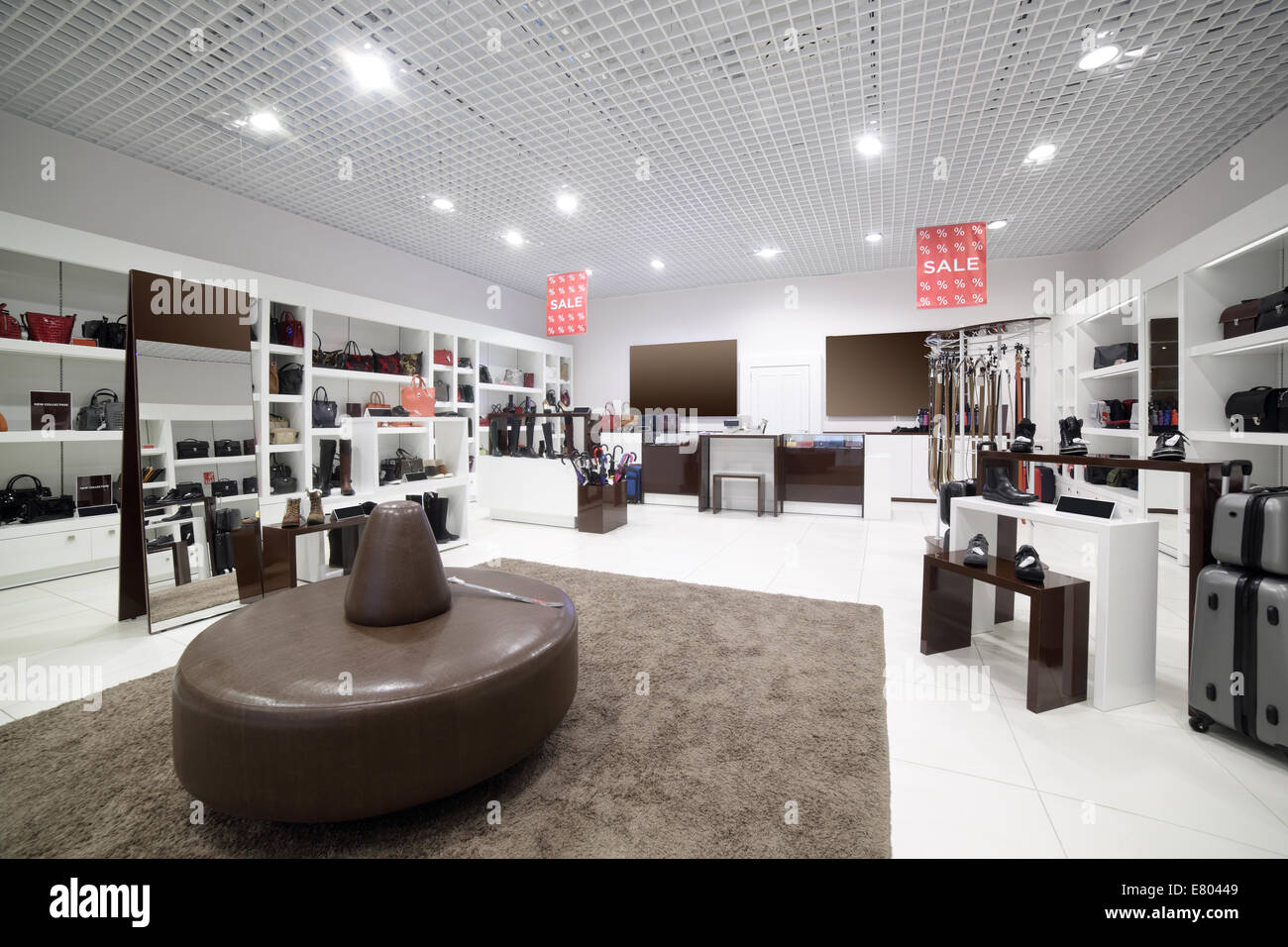 bright and fashionable interior of shoe store in modern mall Stock ...