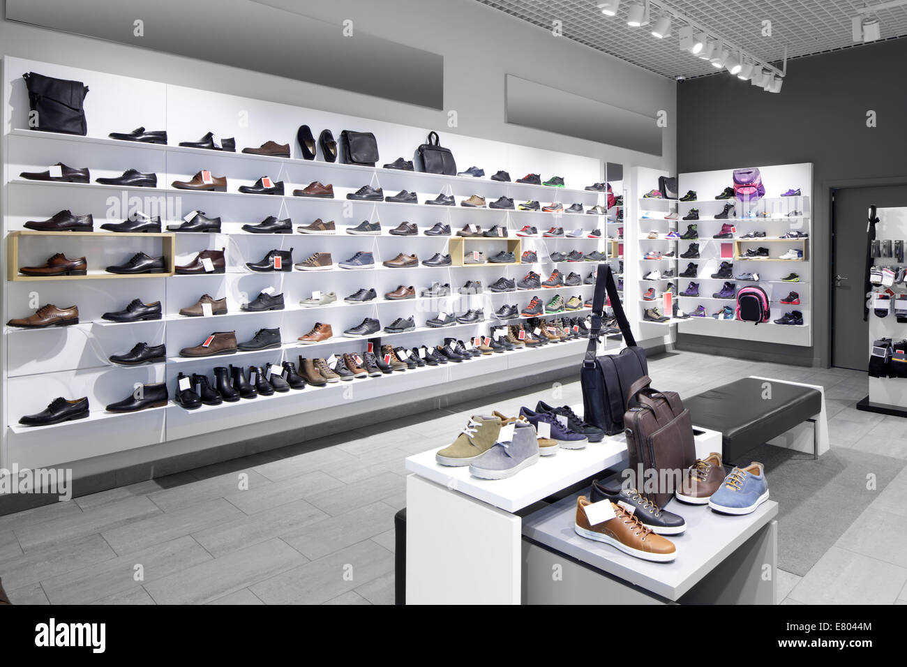 bright and fashionable interior of shoe store in modern mall Stock ...
