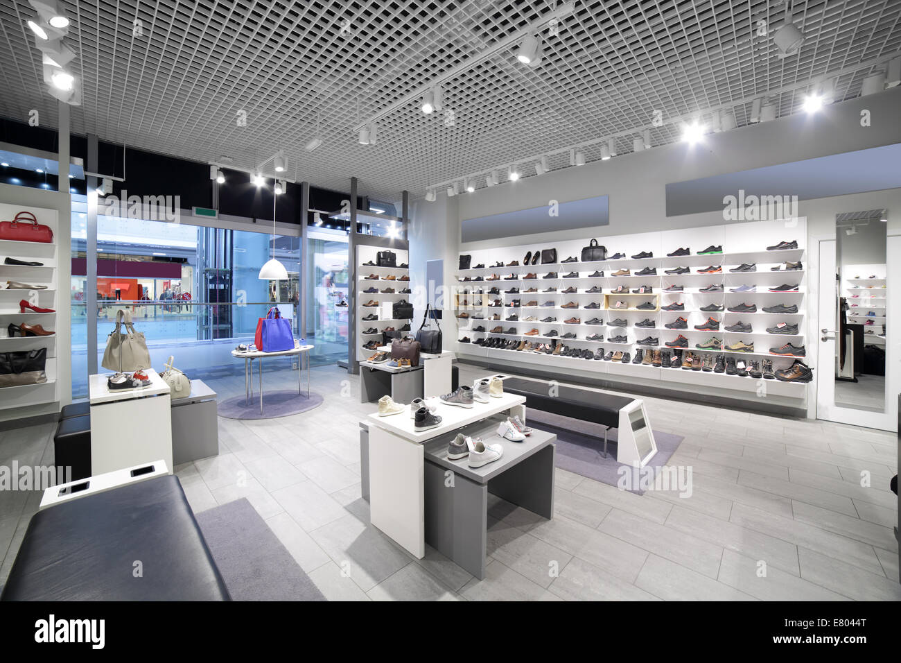 bright and fashionable interior of shoe store in modern mall Stock ...