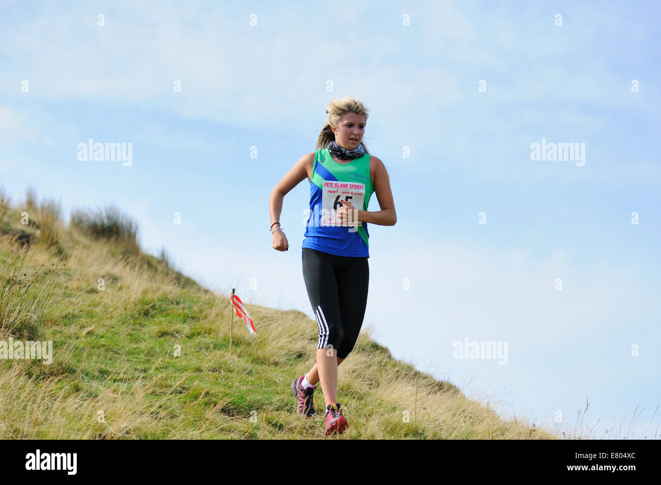 Female fell runner in a race Stock Photo - Alamy
