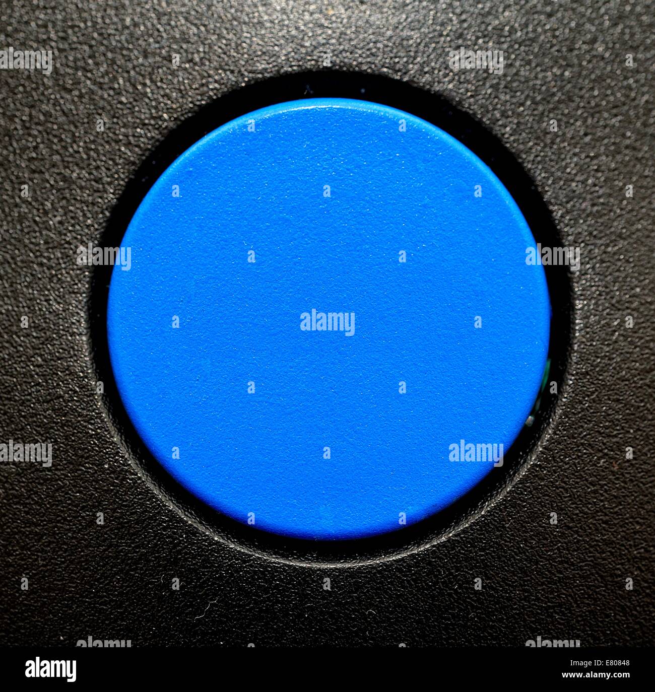 A blank blue button with a black plastic surround Stock Photo - Alamy