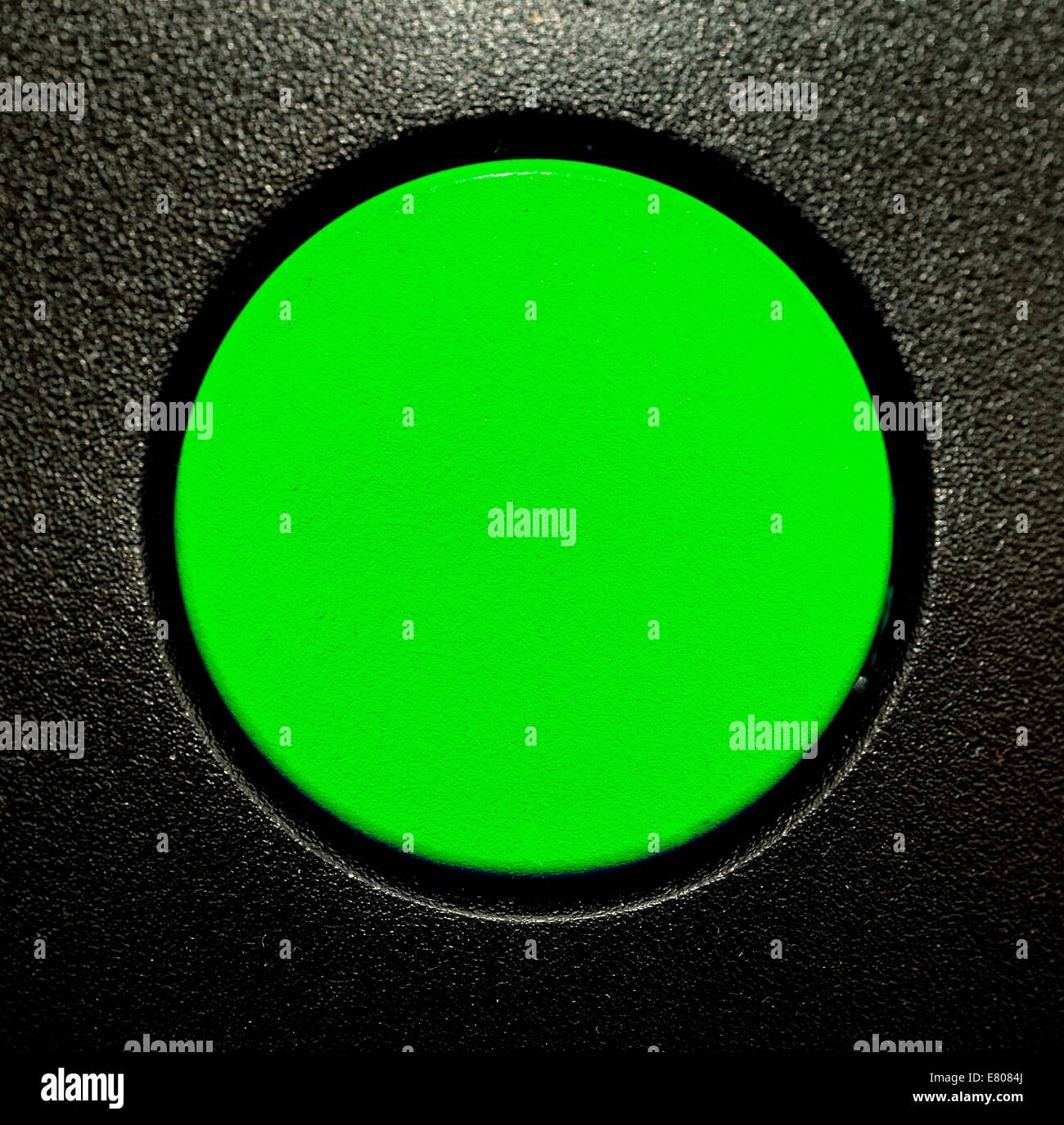 A blank green button with a black plastic surround Stock Photo - Alamy