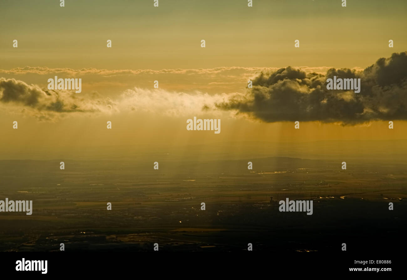 golden sun setting over city from the air Stock Photo - Alamy