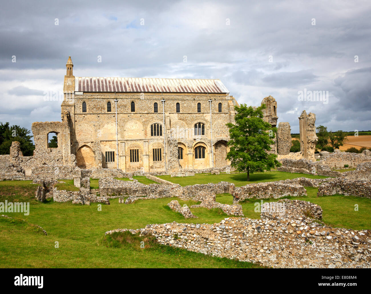 A view of the parish church and ruins of the Benedictine Priory at ...